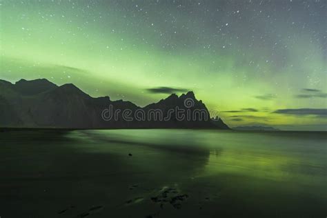 Aurora Borealis Northern Lights Above Stokksnes Beach And Vestrahorn