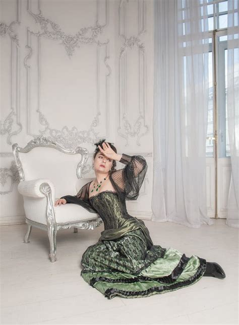 Sad Crying Woman Wearing Medieval Vintage Victorian Style Dress Sitting