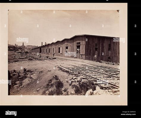 This Historical Photograph Shows Warehouses In A Railroad Yard