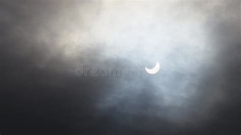 A Solar Eclipse In Cloudy Weather Through A Cloud Partial Solar Eclipse Stock Footage Video