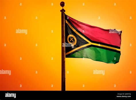 The National Flag Of Vanuatu On A Flagpole Isolated On An Orange