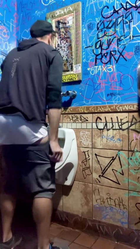 Public Showing Off Tighty Whities At Urinal