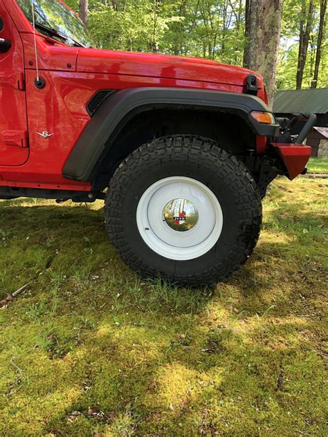 Red Jeep Gladiator Suv In Grass