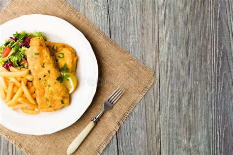 Cod Fried In Breadcrumbs With Fries And Salad Stock Image Image Of