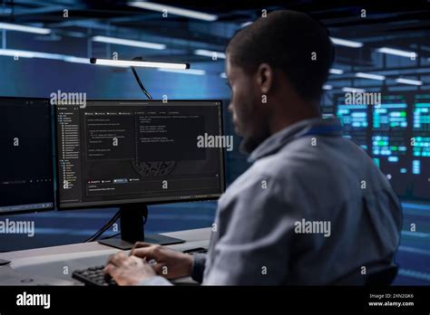 Software Developer Reconfiguring Server Farm To Optimize It For Data