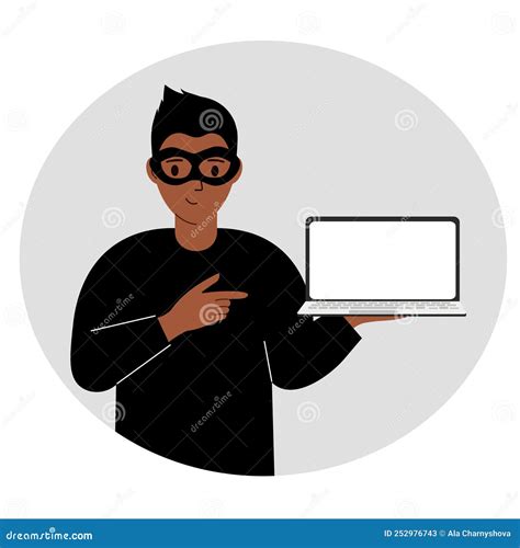 Hacker In A Black Mask With A Computer The Cybercriminal Is Holding A