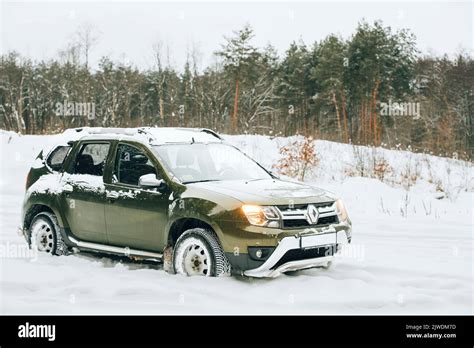 Renault Duster Suv In Winter Coniferous Forest Compact Crossover