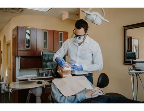 Dr Alon Bekerman Dmd Performing Root Canal At Premiere Dental Of