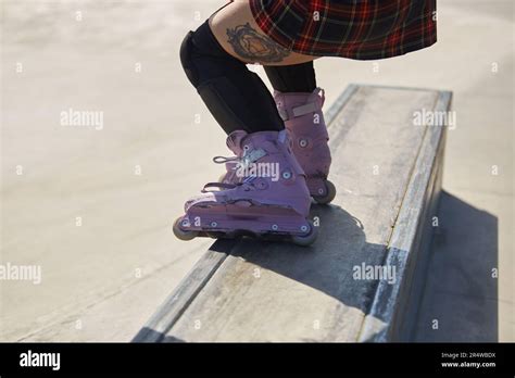 Skater Girl Grinding On A Ledge In A Skatepark Feet Of Aggressive Inline Roller Blader