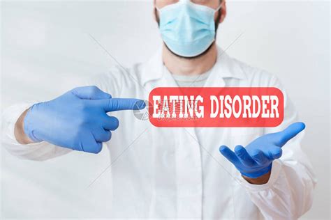 显示饮食紊乱的文本符号商业图片文字短信在其饮食行为中出现疾病或严重干扰化验室技术员使用空粘贴纸智能手机smart高清图片下载 正版图片