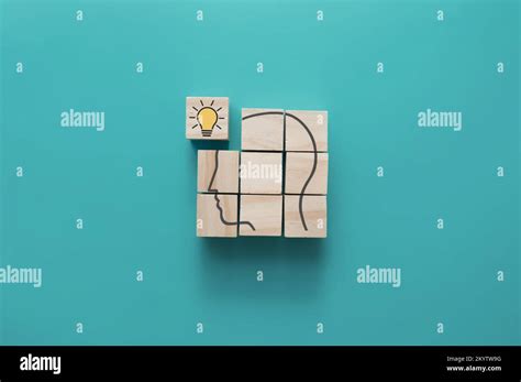 Human Head Outline On Wooden Blocks With Missing Piece Light Bulb
