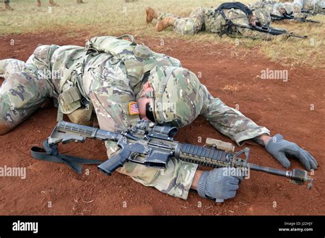 Infantrymen Assigned To The 25th Infantry Division Practice Low