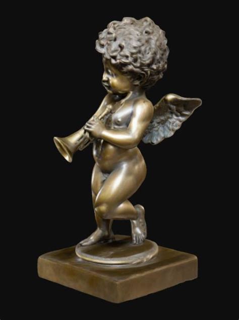 The Object Is A Detailed Bronze Sculpture Of A Cherubic Figure With