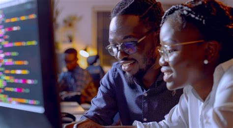 Premium Photo Happy Male And Female Software Developers Collaborating