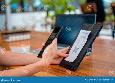 Woman Using Contactless Payment By Mobile Phone With Qr Code At Cafe