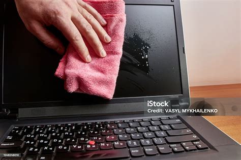 Man Washes Laptop Display With Detergent And Rag Pc Care Concept Stock