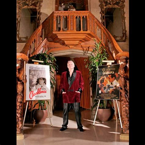 Hugh Hefner Posing In His Library Inside The Playboy Mansion