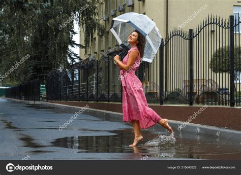 Girl Dancing In Rain With Umbrella