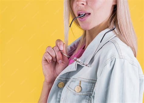Free Photo Close Up Unrecognisable Woman Biting Glasses