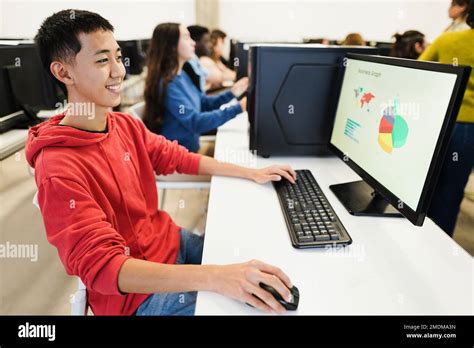 Young Students Using Computers Inside Technology Class At School Room