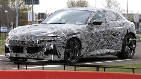 Ferrari Purosangue Spied In Wavy Wrap Revealing More