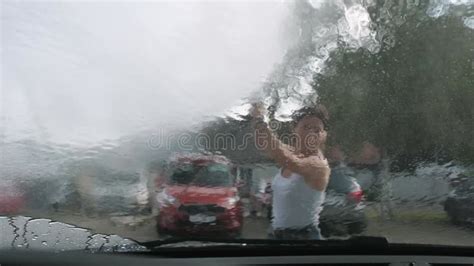 Girl Washing Car Window At Touchless Car Wash Under High Pressure Stock