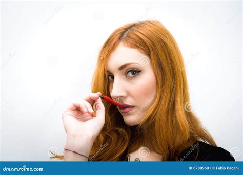 Young Redhead Woman With Red Hot Chili Pepper Portrait Stock Image Image Of Female Redhead