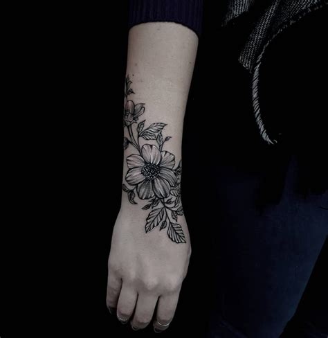 55 Pretty And Meaningful Flower Wrist Tattoo Ideas