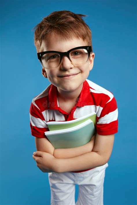 Smart Wunderkind In Nerdy Glasses And Red Striped Shirt Looking At