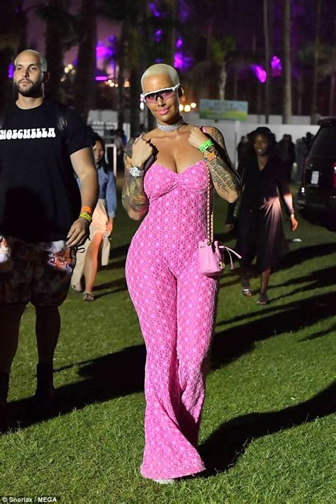 Amber Rose Flaunts Her Curves In Striking Pink Jumpsuit At Coachella
