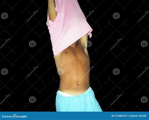 Black Background With A Young Man Undressing Stripping Stock Image Image Of Shirtless