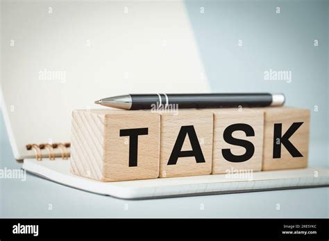 Task Office Notebook Pen And Wooden Blocks With The Word Task Written On It Beautiful Light