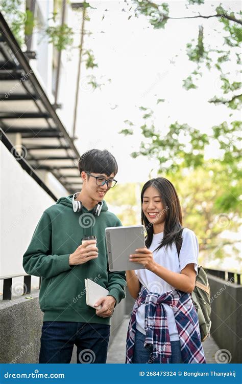 Happy Asian Male College Students Sharing His Ideas On A School Project