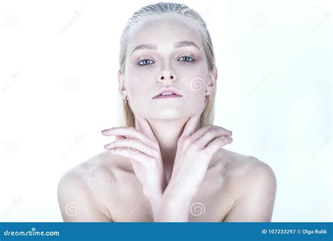 Portrait Of Young Beautiful Blond Model With Nude Make Up Slicked Back