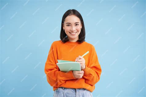 Free Photo Smiling Cute Girl Student Making Notes Writing Down