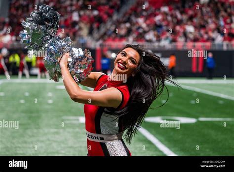 An Atlanta Falcons Cheerleader Performs During The Second Half Of An