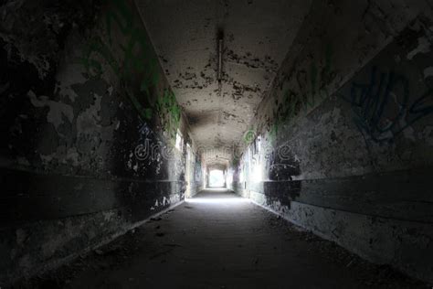 Old Broken Passage Tunnel With Light At The End Photographed With Wide Angle Lens Stock Image