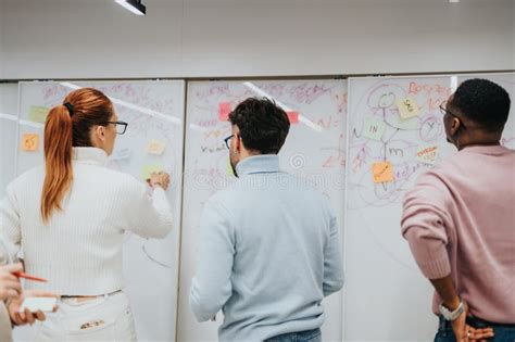 Business Colleagues Collaborating And Brainstorming New Ideas In A