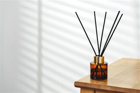 Premium Photo Elegant Reed Diffusers On Wooden Surface With Soft