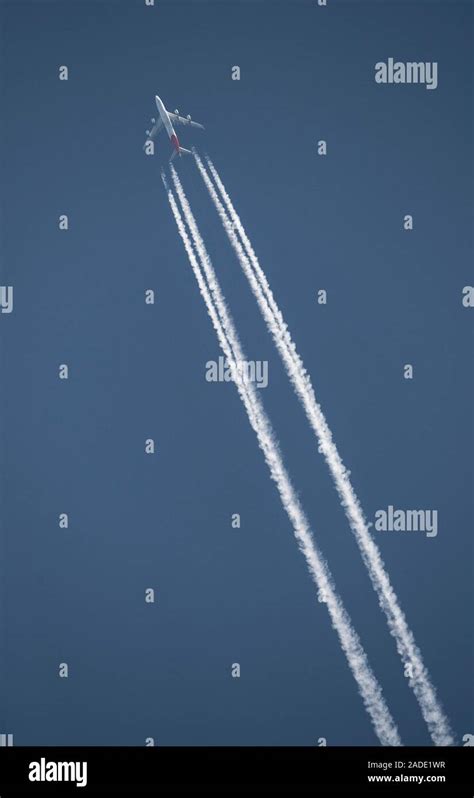 A Passenger Airliner With Trailing Wingtip Vortices In The Sky Above
