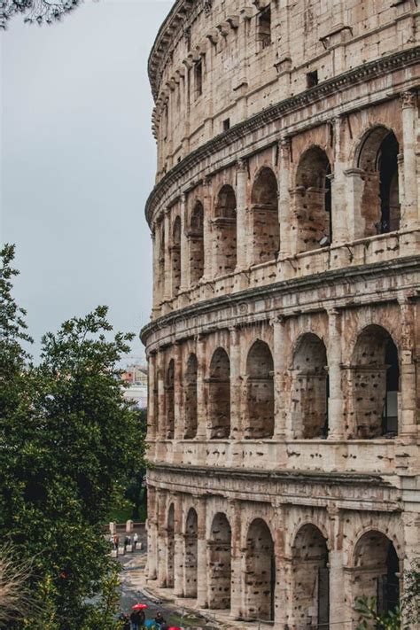 A Vertical Shot Of A Beautiful Section Of The Historic Colosseum In