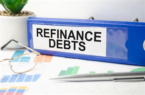 Premium Photo Refinance Debts Text Written On Folder With Documents