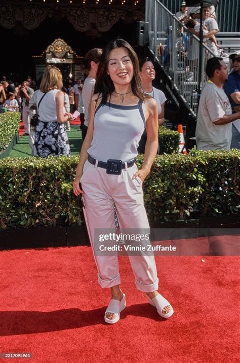 American Actress Ming Na Wen Wearing A Blue Vest With Dark Blue Trim