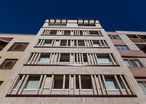 Pale Brickwork Creates Decorative Facade For Iranian Apartment Building