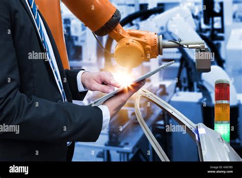 Engineer Hand Using Tablet With Machine Real Time Monitoring System