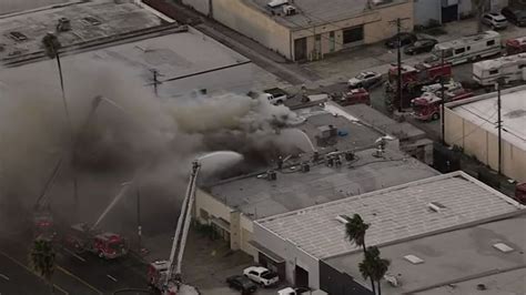 Firefighters Battle A Commercial Building Fire In The Compton Area