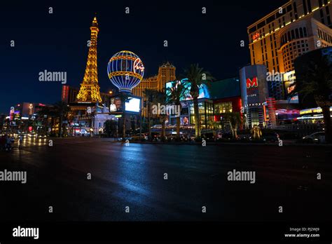 Las Vegas Strip At Night With Paris Hotel And Faux Eiffel Tower Las