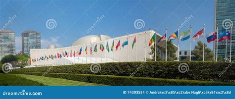 Un United Nations General Assembly Building With World Flags Fly