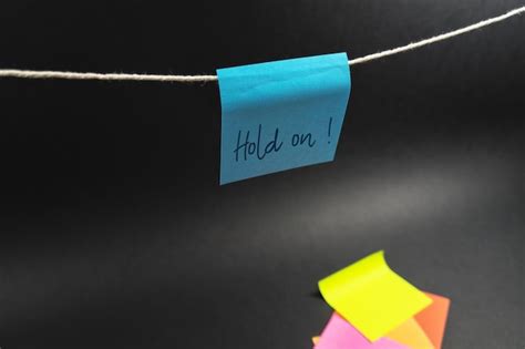 Premium Photo Close Up Of Text On Adhesive Note Stuck On String