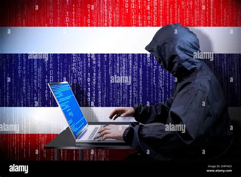 anonymous hooded hacker flag of thailand binary code cyber attack